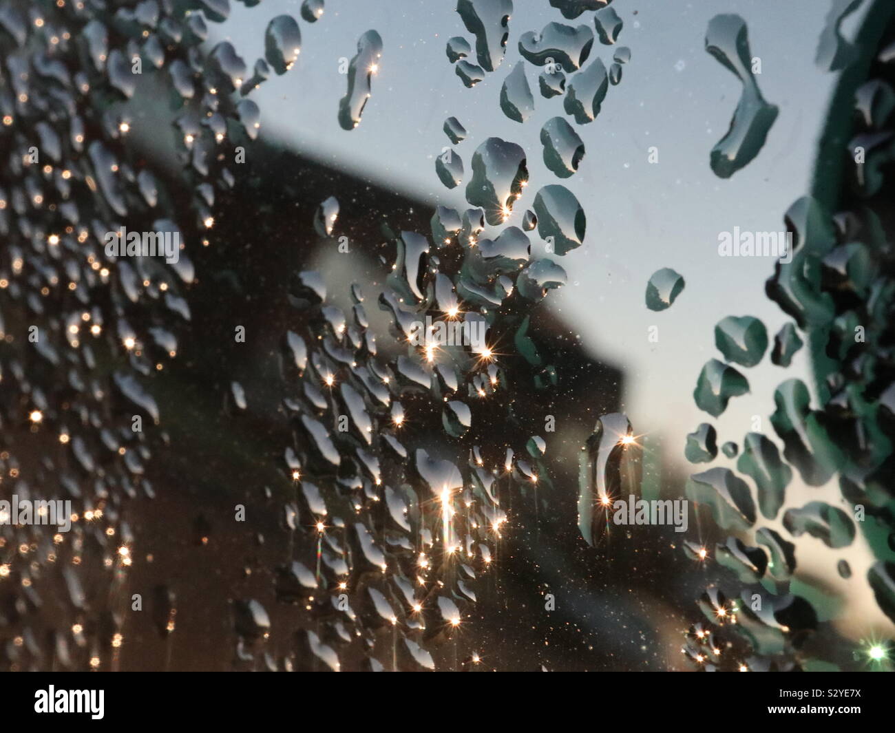 Melting window frost with sunshine star bursts Stock Photo - Alamy