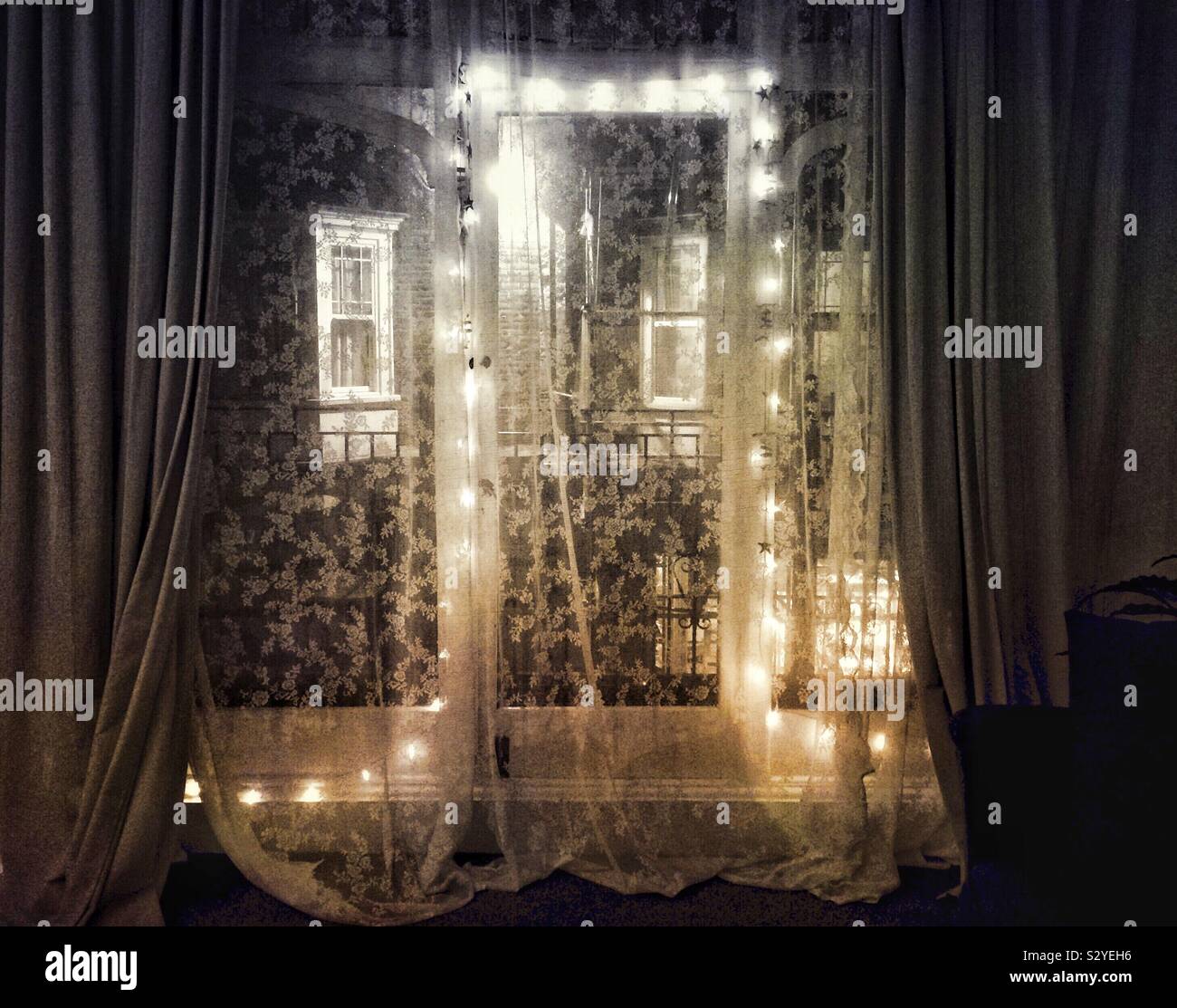 Curtains and lights inside windows hi-res stock photography and images ...