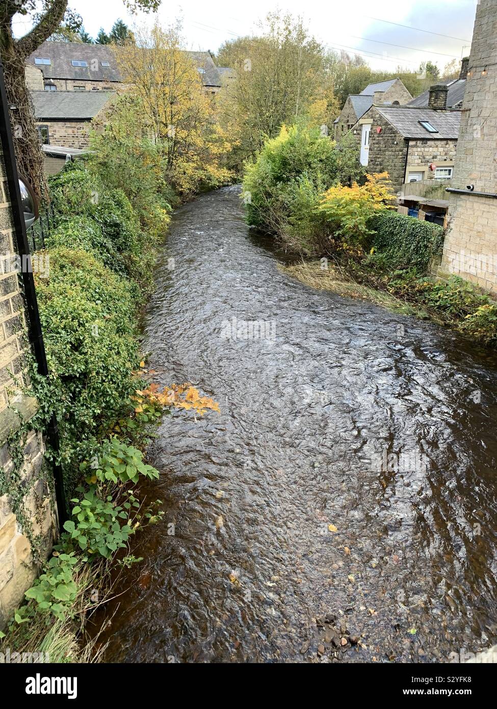 River through houses Stock Photo - Alamy