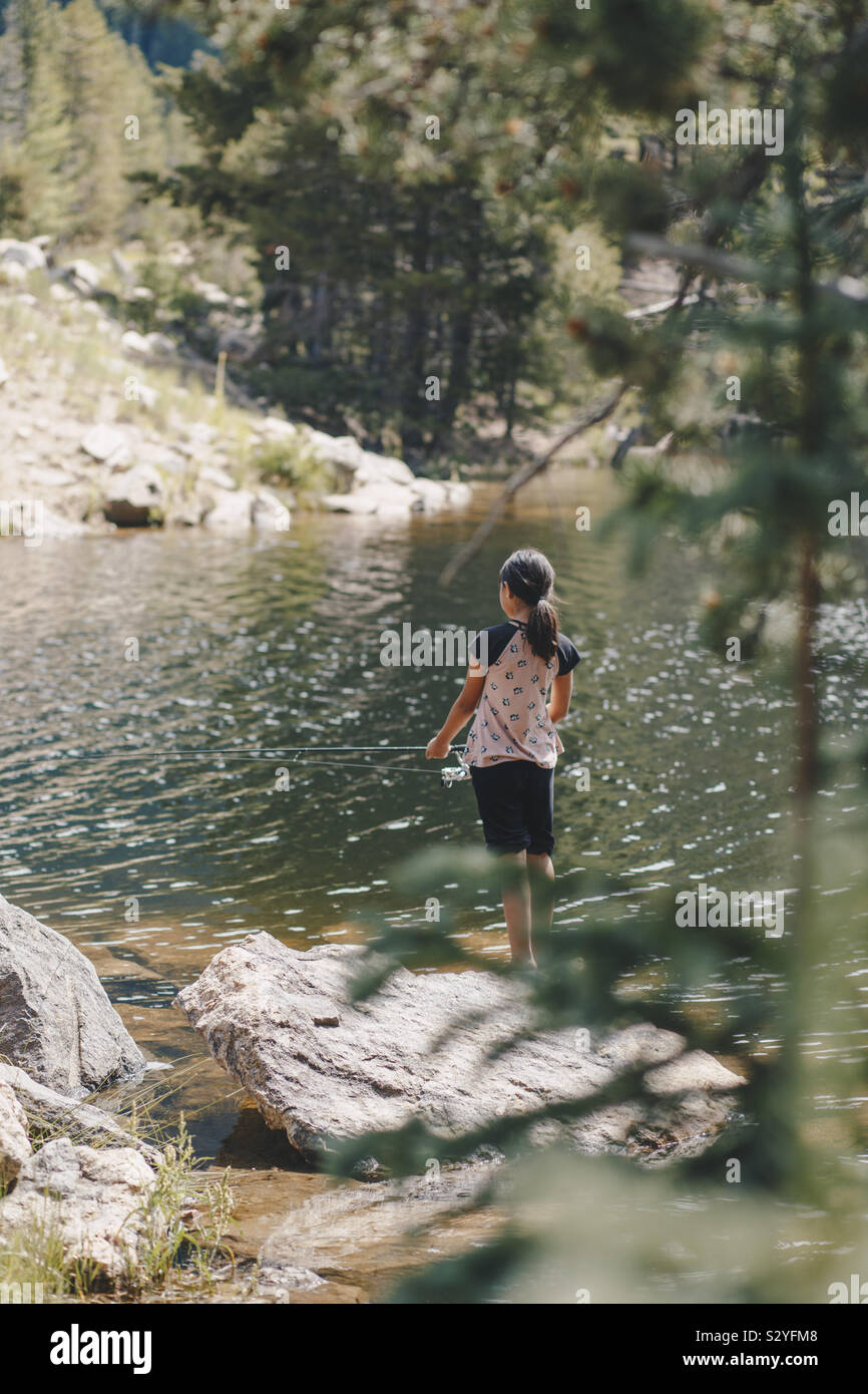 Girl fishing by the lake hi-res stock photography and images - Alamy