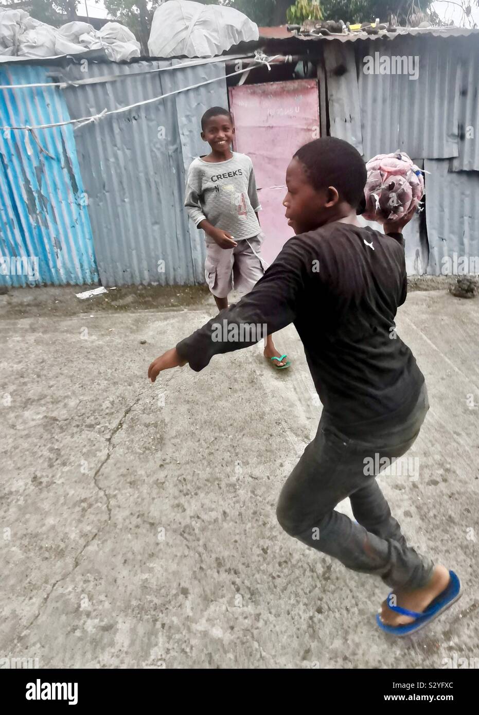 Comoran children playing football in the streets of Moroni, Comoros ...