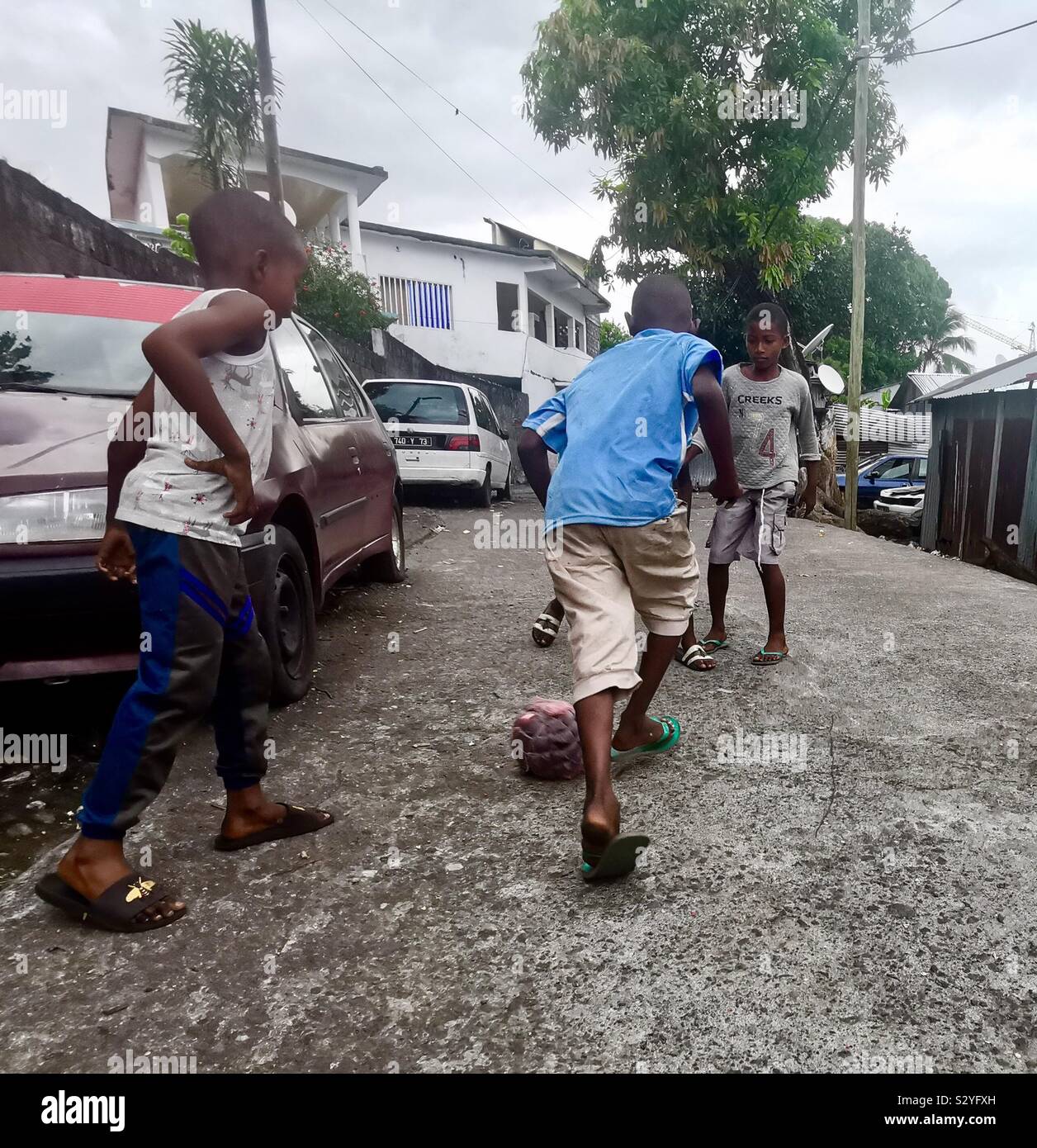 Comoran children playing football in the streets of Moroni, Comoros ...