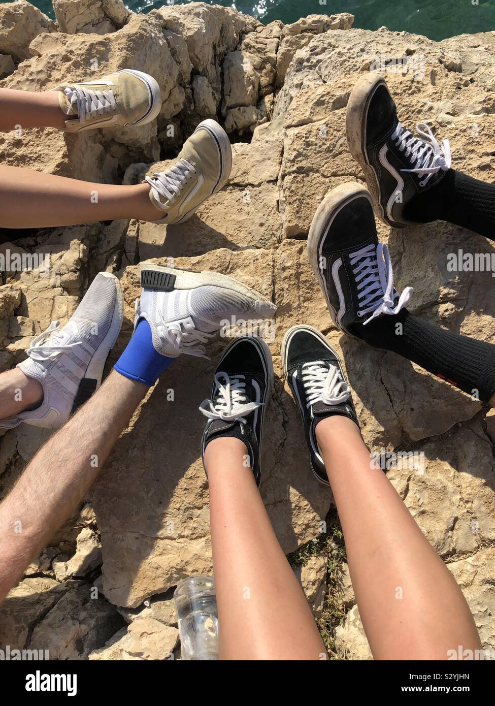 Trainers of a group Stock Photo - Alamy