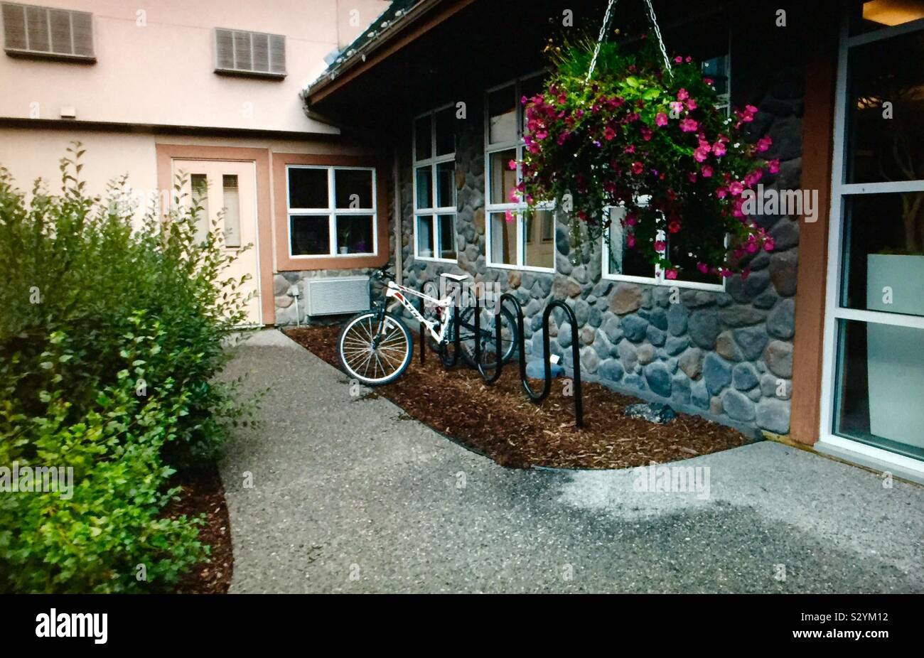 Bicycle in a bike rack at a hotel Stock Photo - Alamy
