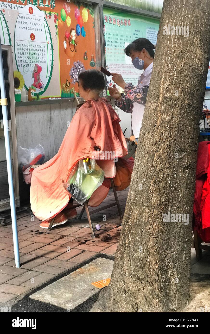 Haircut on street hi-res stock photography and images - Alamy