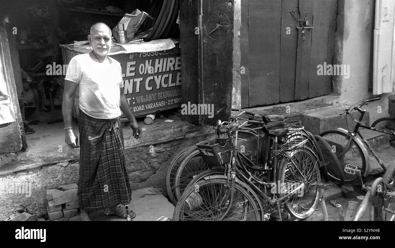 Old chap in Varanasi at his bicycle shop Stock Photo - Alamy