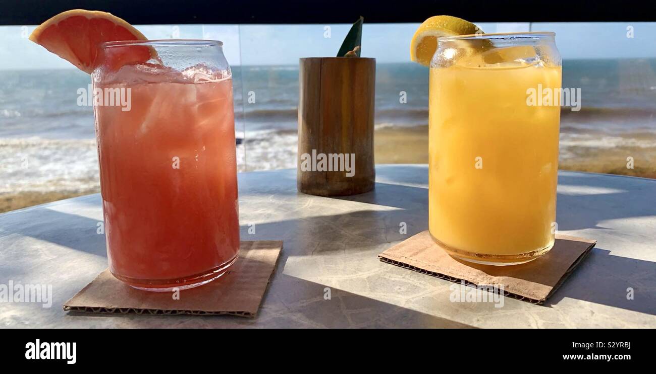 Fresh fruit juices on beach Stock Photo - Alamy
