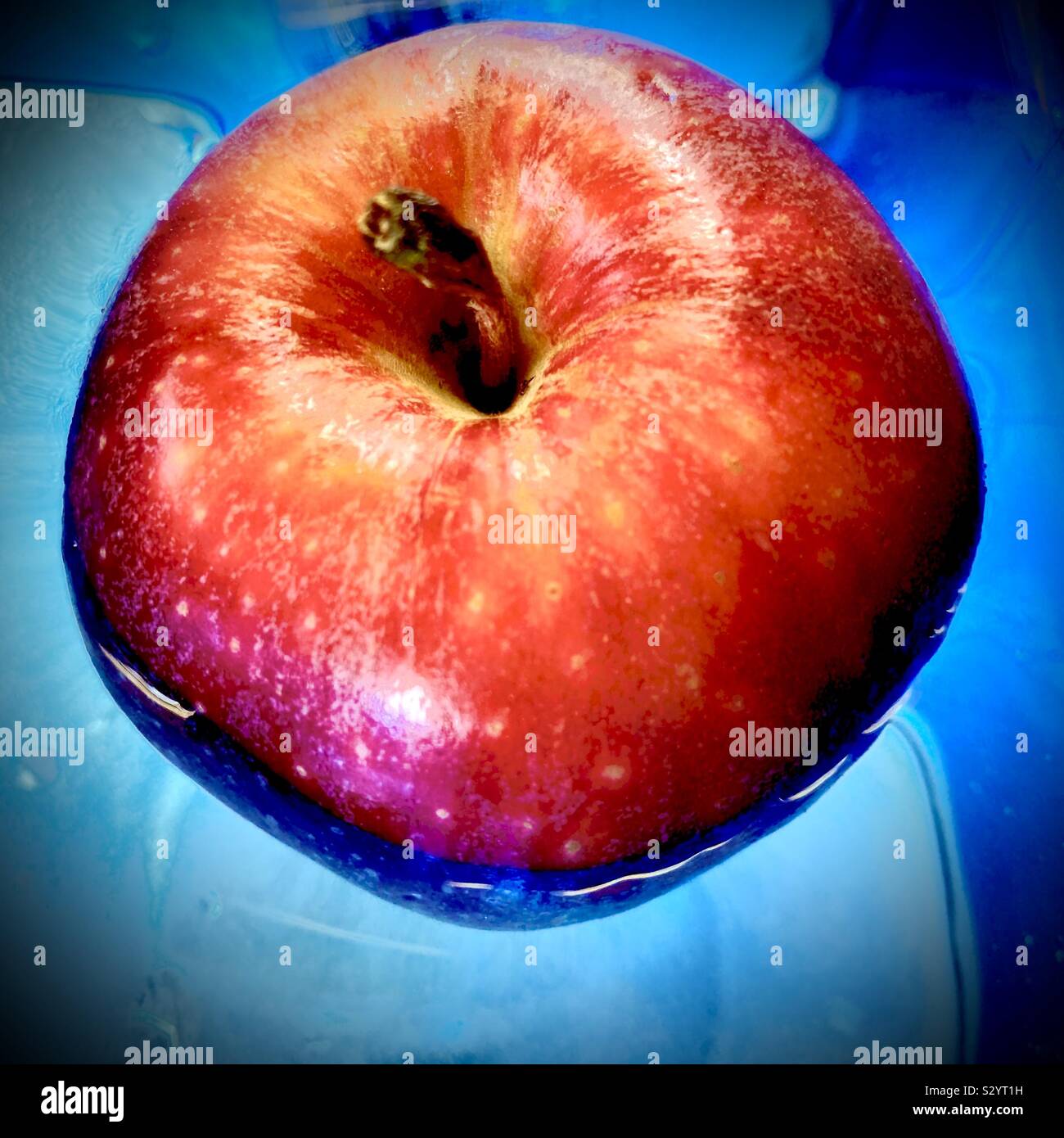 Apple floating in water Stock Photo - Alamy