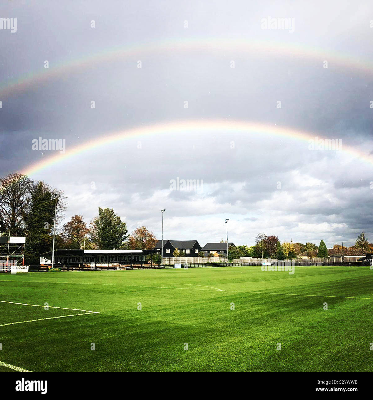 Double rainbow over football stadium Stock Photo - Alamy