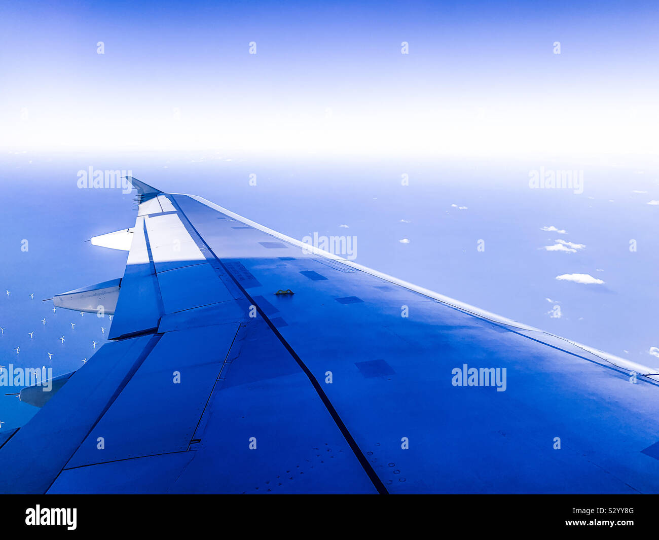 Wing View from Aer Lingus Airbus A320 in flight with blue sky over ...