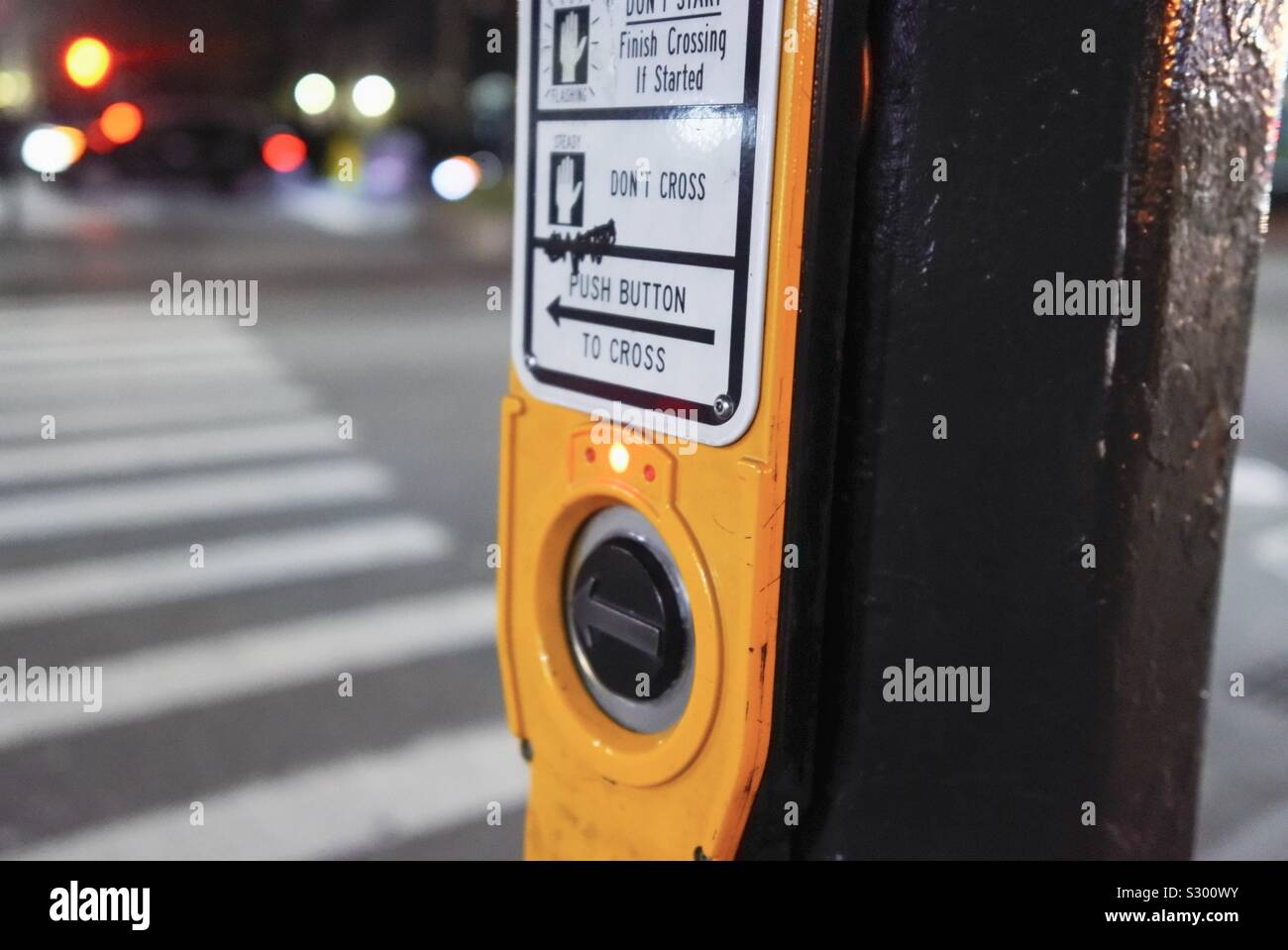 Walk sign button at pedestrian crossing Stock Photo - Alamy