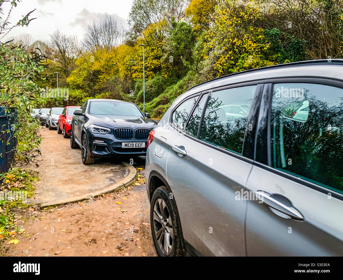 Parked cars on the side of the road hi-res stock photography and images - Alamy