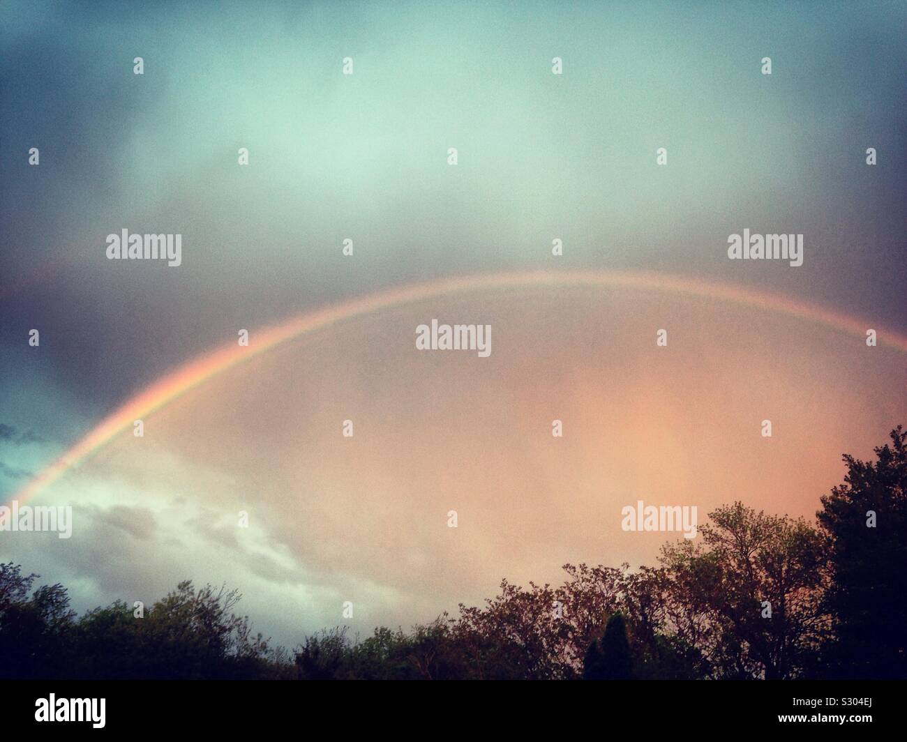 Giant rainbow in sky Stock Photo - Alamy