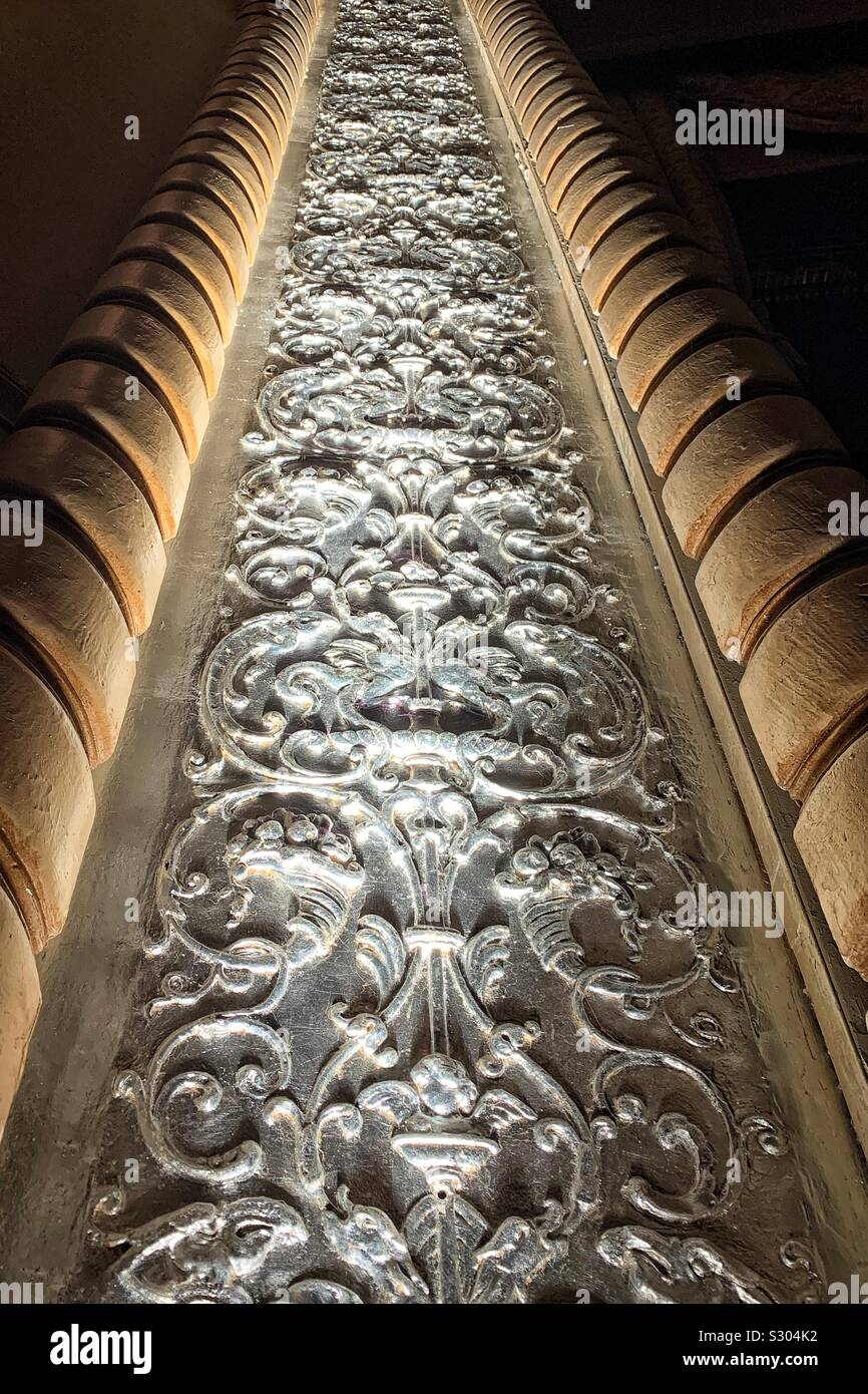 Beautiful mysterious and fancy silver wall column in a vintage theater ...