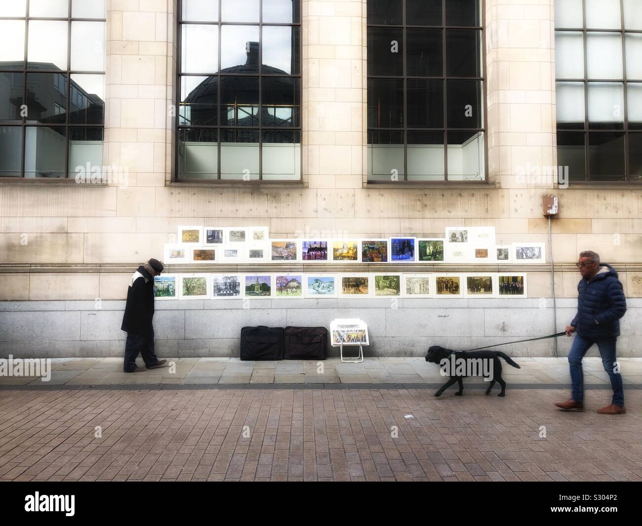 Street seller selling art Stock Photo - Alamy