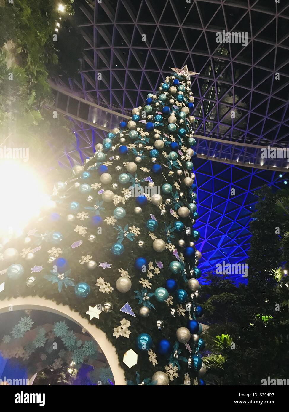Vertical Christmas tree lighted up and decorated nicely in Jewel Changi ...