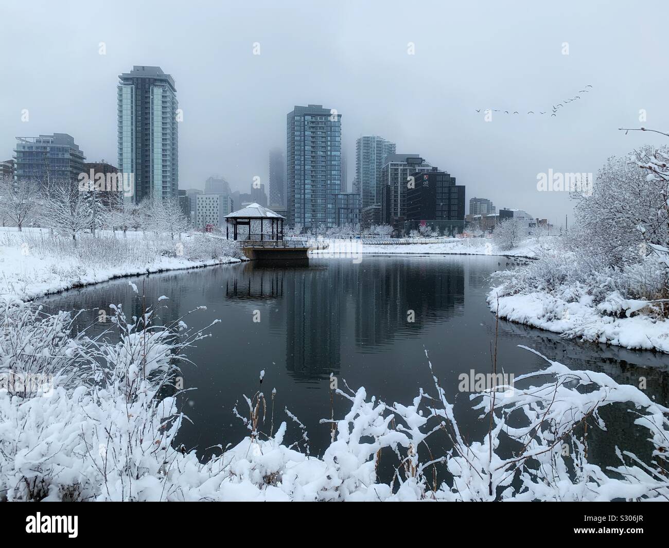 A view of Downtown Calgary from The Fort Calgary historic park, snow ...