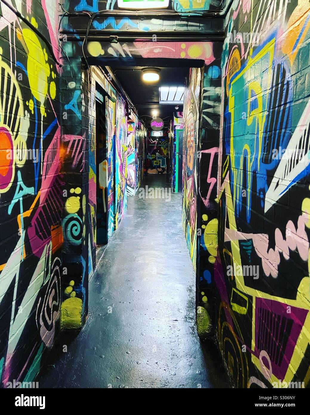 Corridor covered in graffiti Stock Photo - Alamy