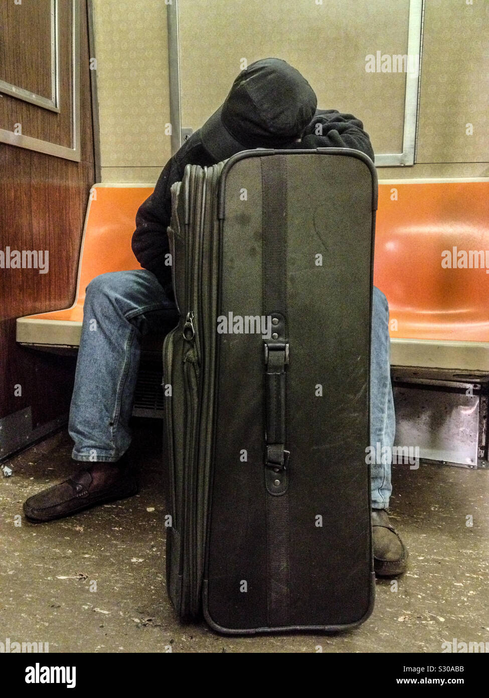 Homeless man sleeping on train hi-res stock photography and images - Alamy