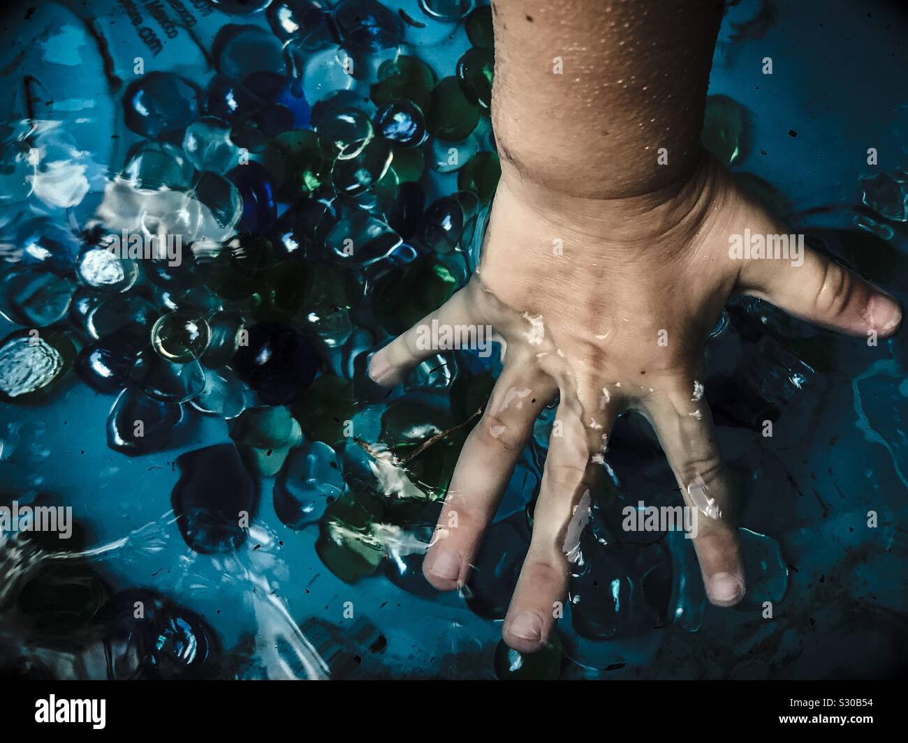 Hand reaching into water hi-res stock photography and images - Alamy