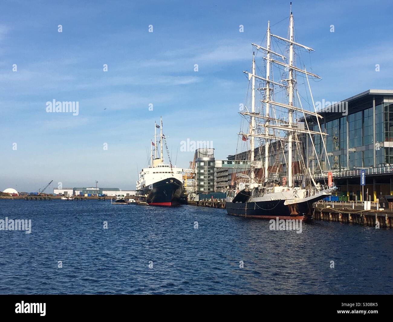 Royal Yacht Britannia and a Tall Ship Moored alongside in the Port of ...