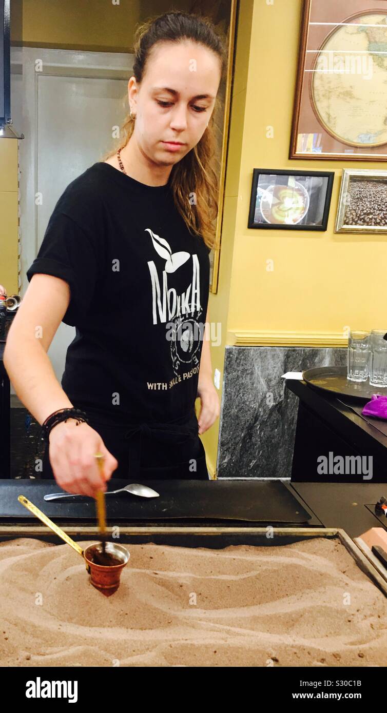 Greek coffee brewed in the hot sand Stock Photo - Alamy