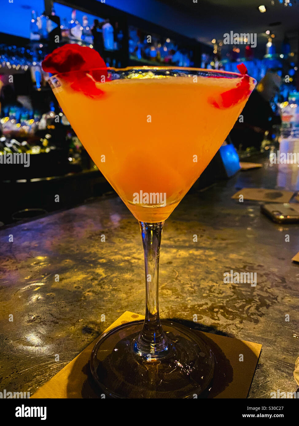 cocktail on a bar orange in tall glass Stock Photo - Alamy
