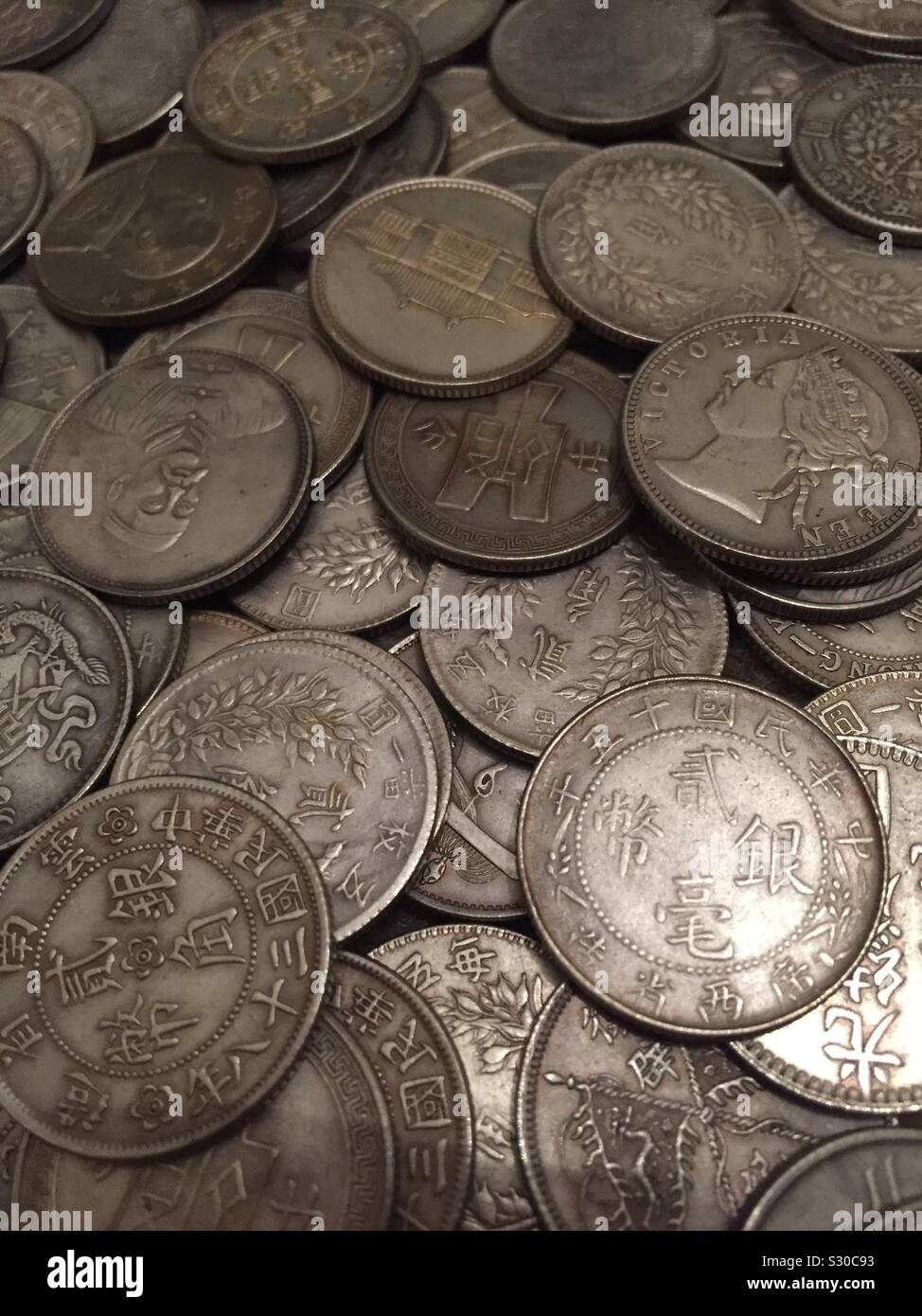 Chinese silver vintage coins Stock Photo - Alamy
