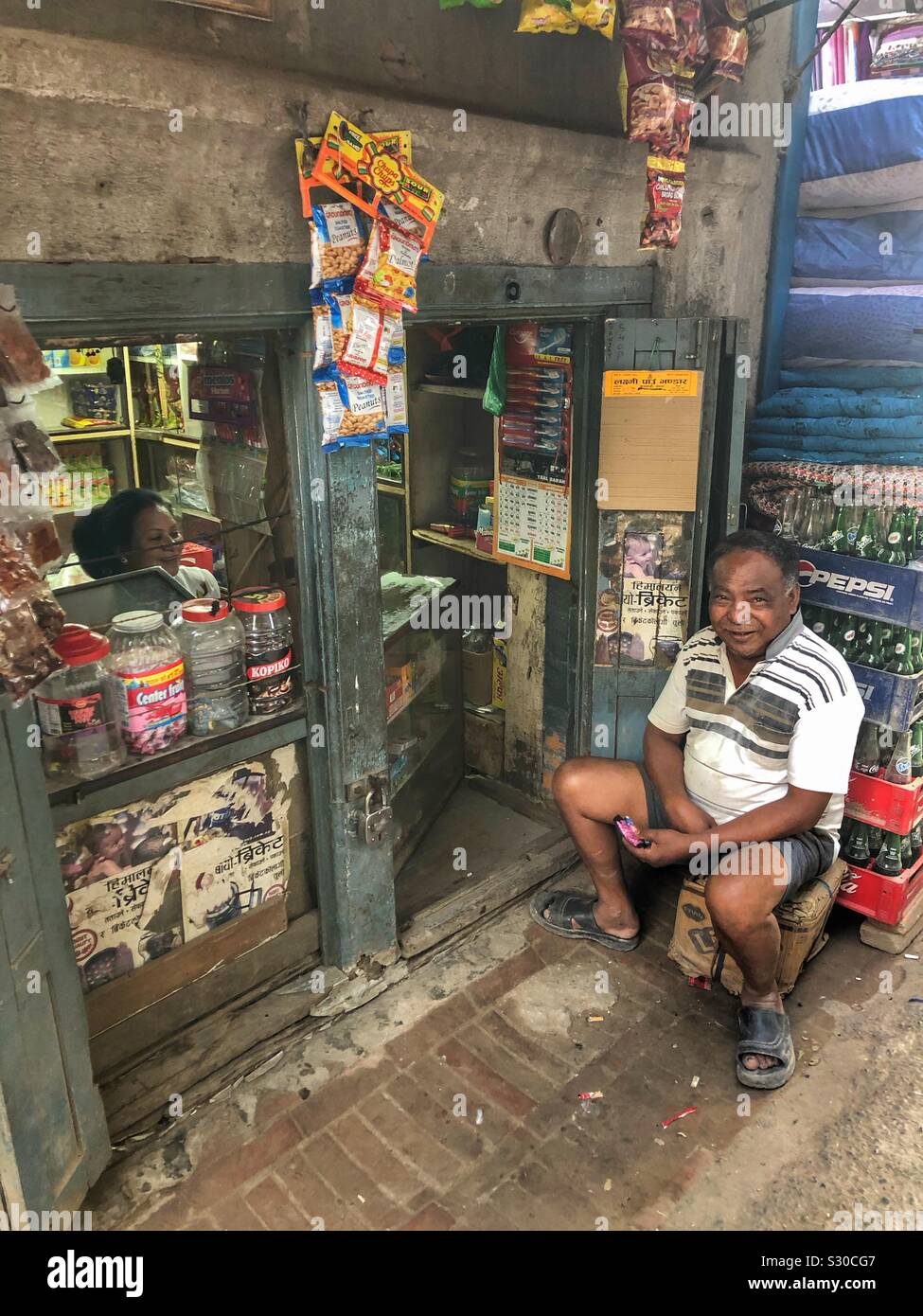 Shopkeeper in Kathmandu, Nepal Stock Photo - Alamy