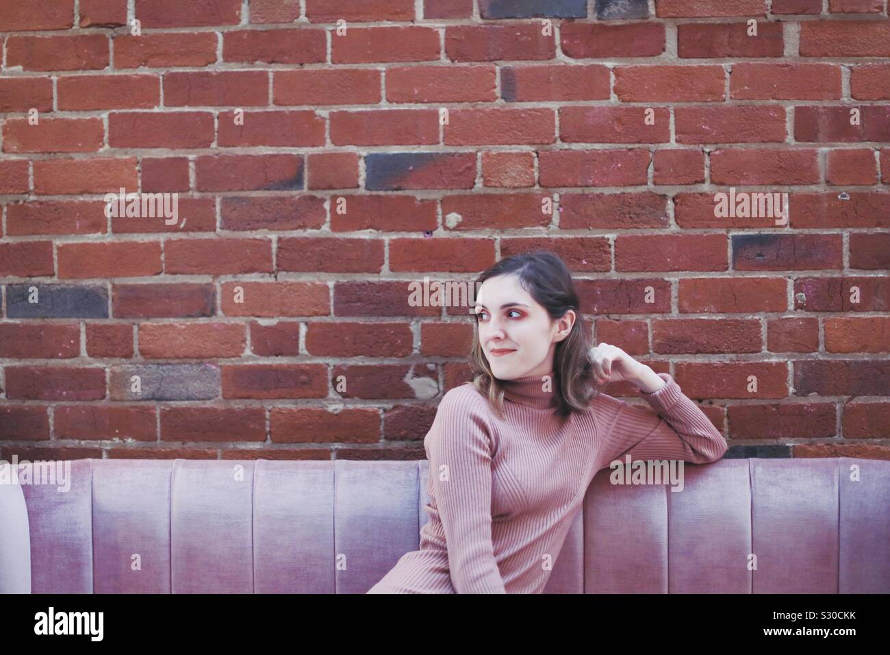 Girl by brick wall hi-res stock photography and images - Alamy