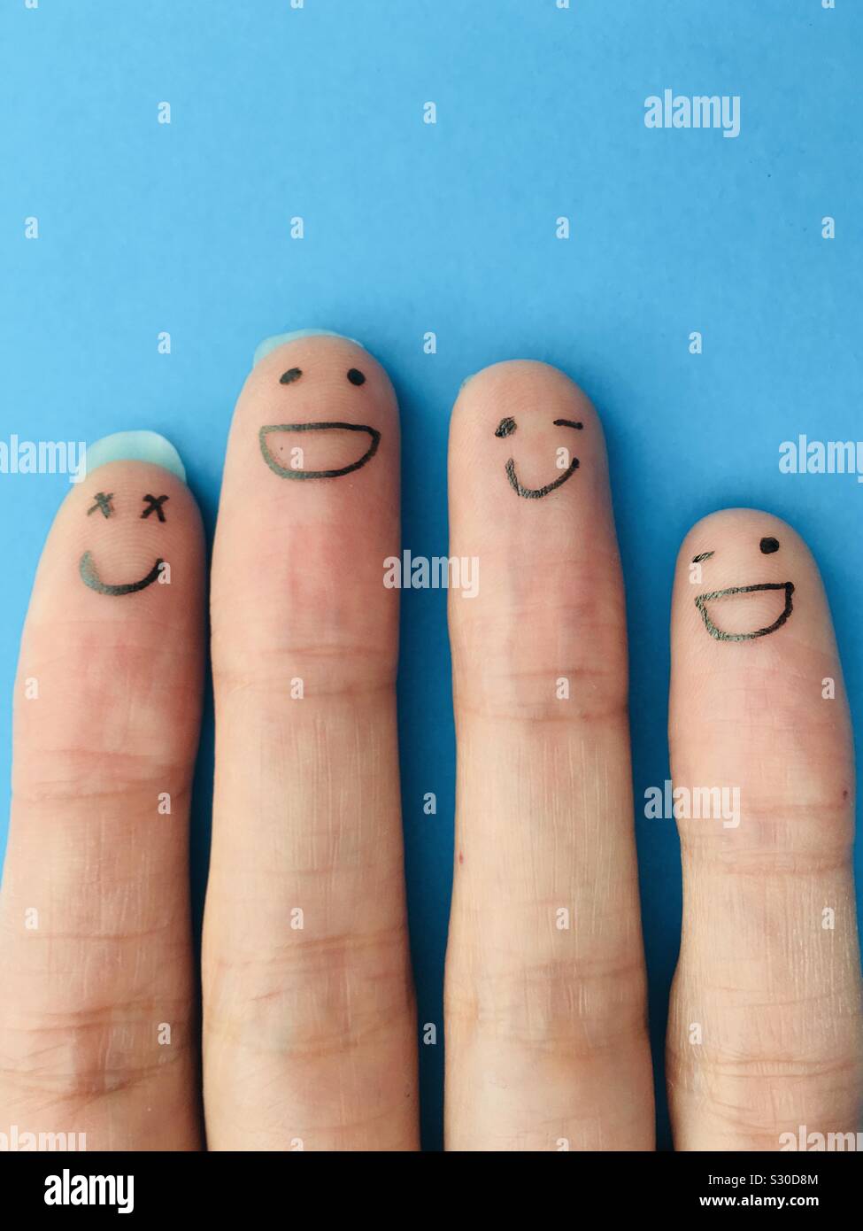 Happy, smiling, laughing emojis and faces on human fingertips Stock ...