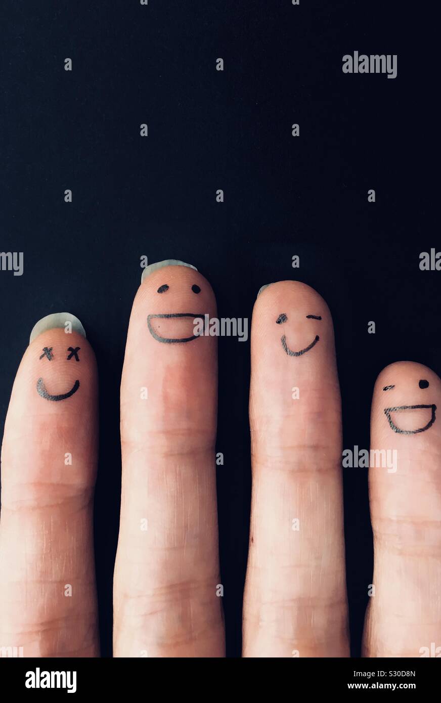 Happy, smiling, laughing emojis and faces on human fingertips Stock ...