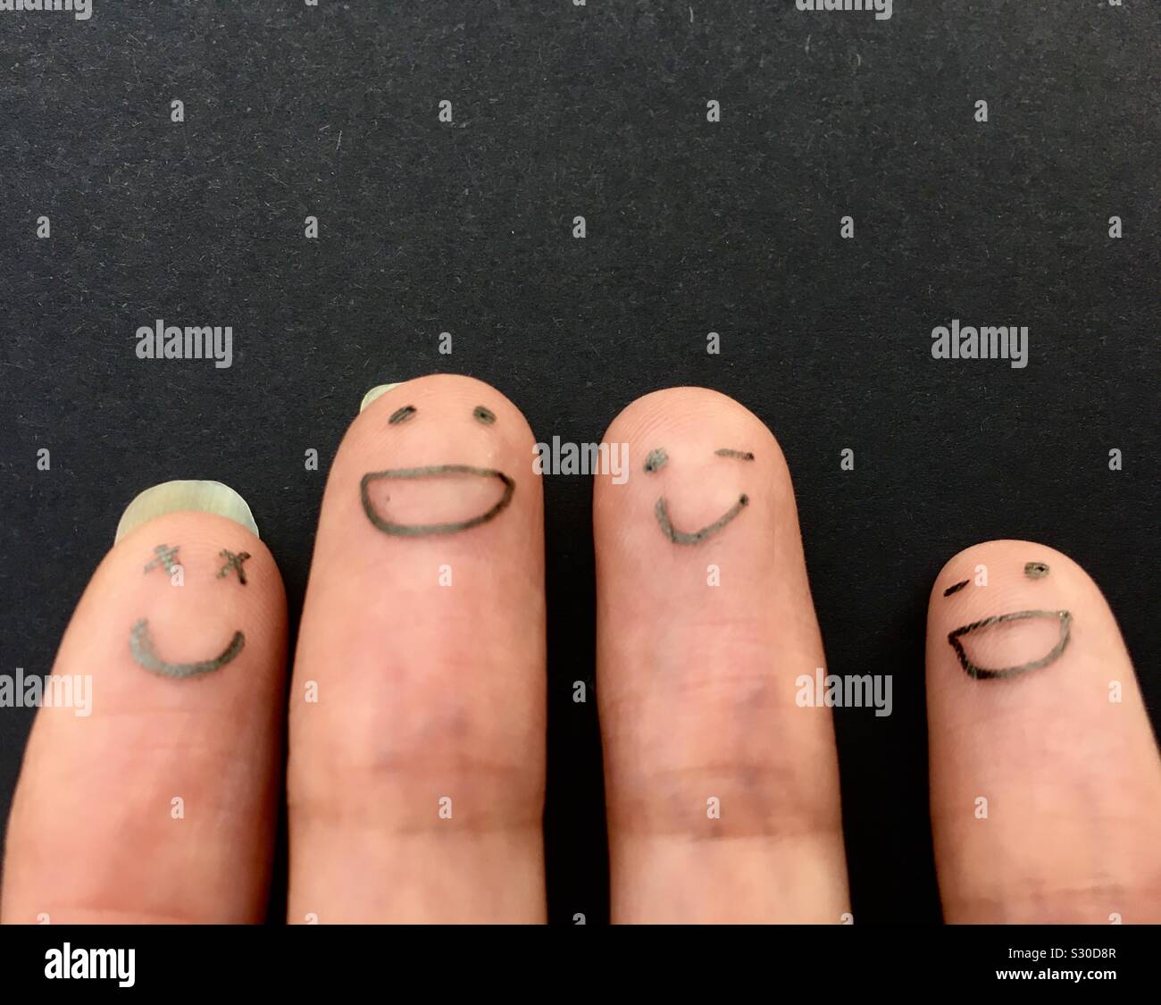 Happy, smiling, laughing emojis and faces on human fingertips Stock ...