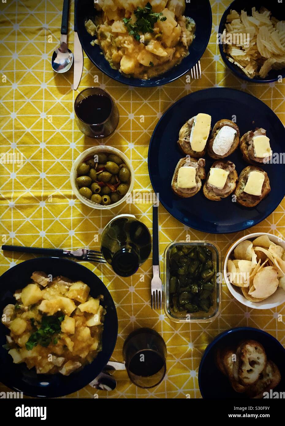 Spanish style home made dinner with tapas, green olives, marmitako ...