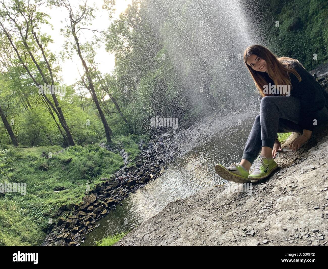 Girl under waterfall hi-res stock photography and images - Alamy