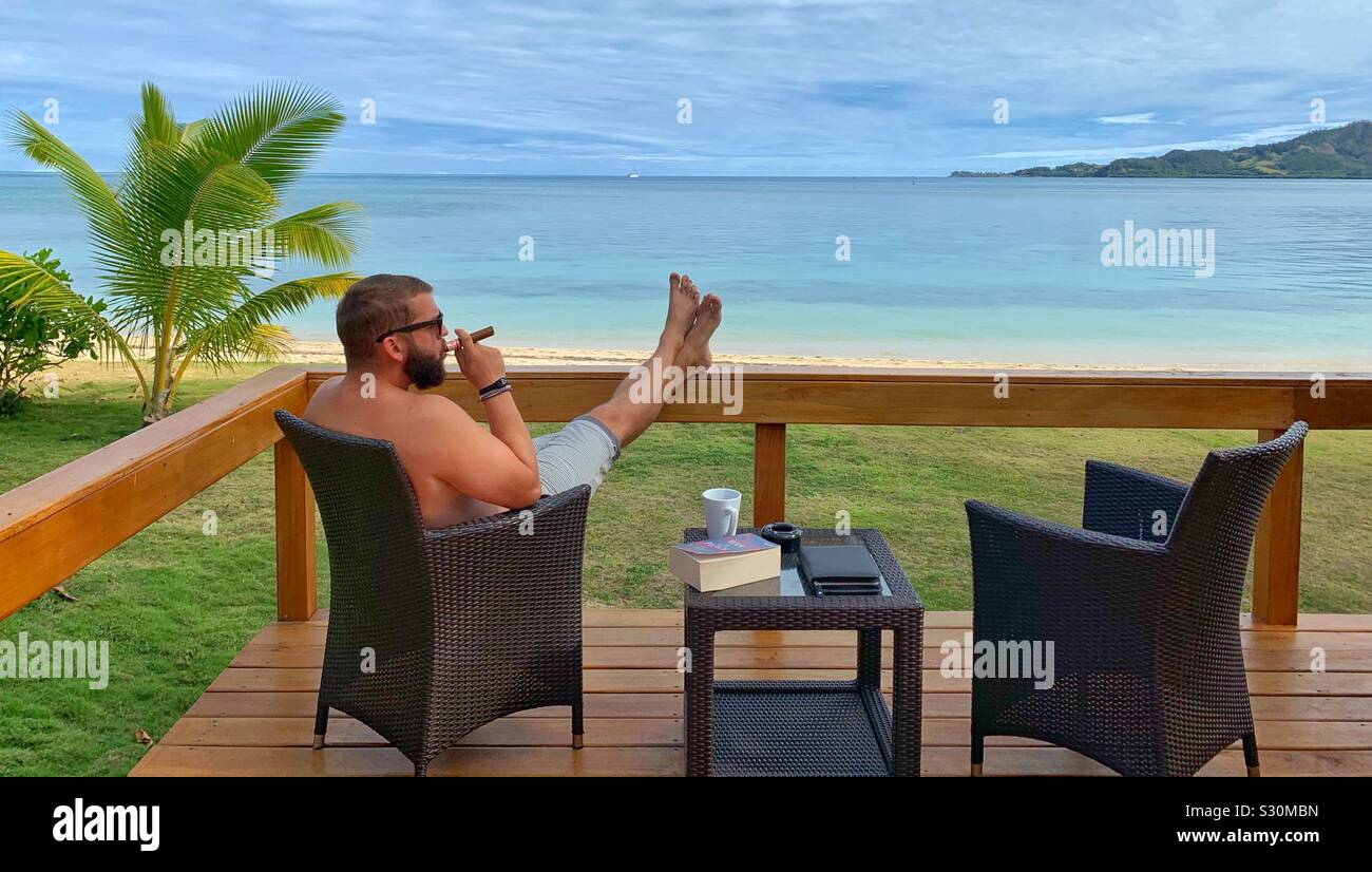 Cigar smoking in paradise Stock Photo - Alamy