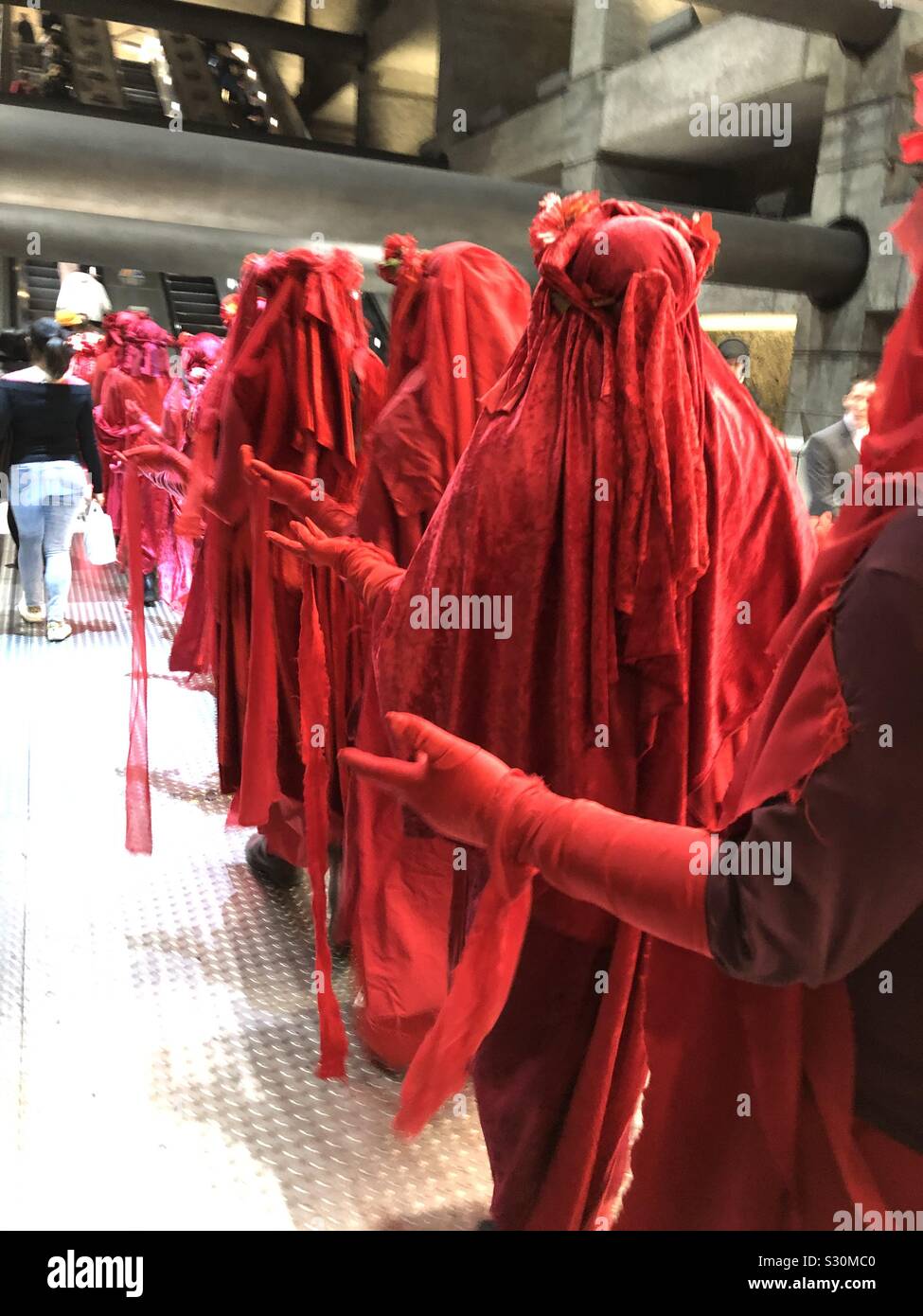 Extinction Rebellion Red Brigade on London Underground Stock Photo - Alamy