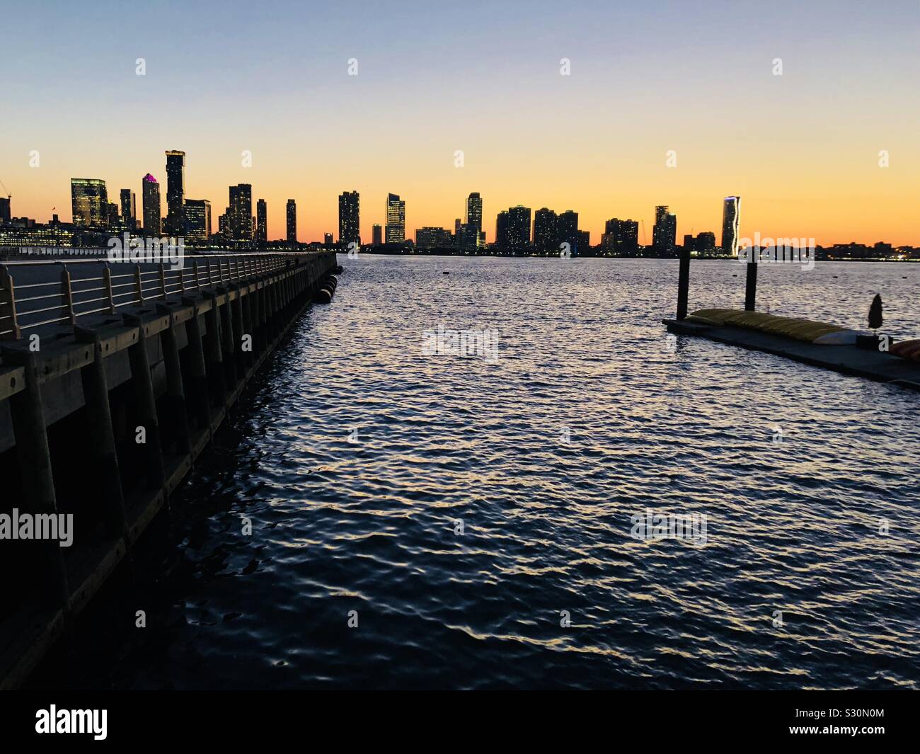 Evening harbour side view Stock Photo - Alamy