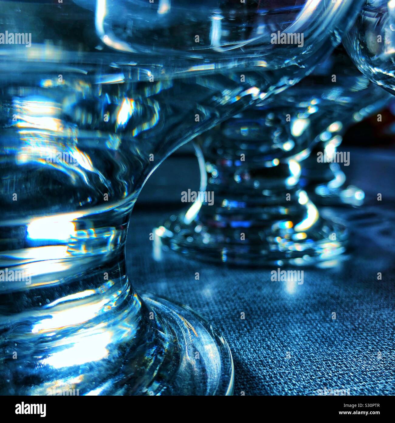 Looking through wine glasses Stock Photo - Alamy