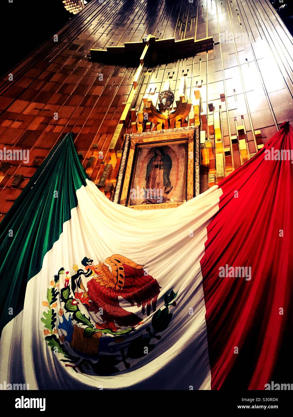 The Mexican flag decorates the altar of Our Lady of Guadalupe in the ...