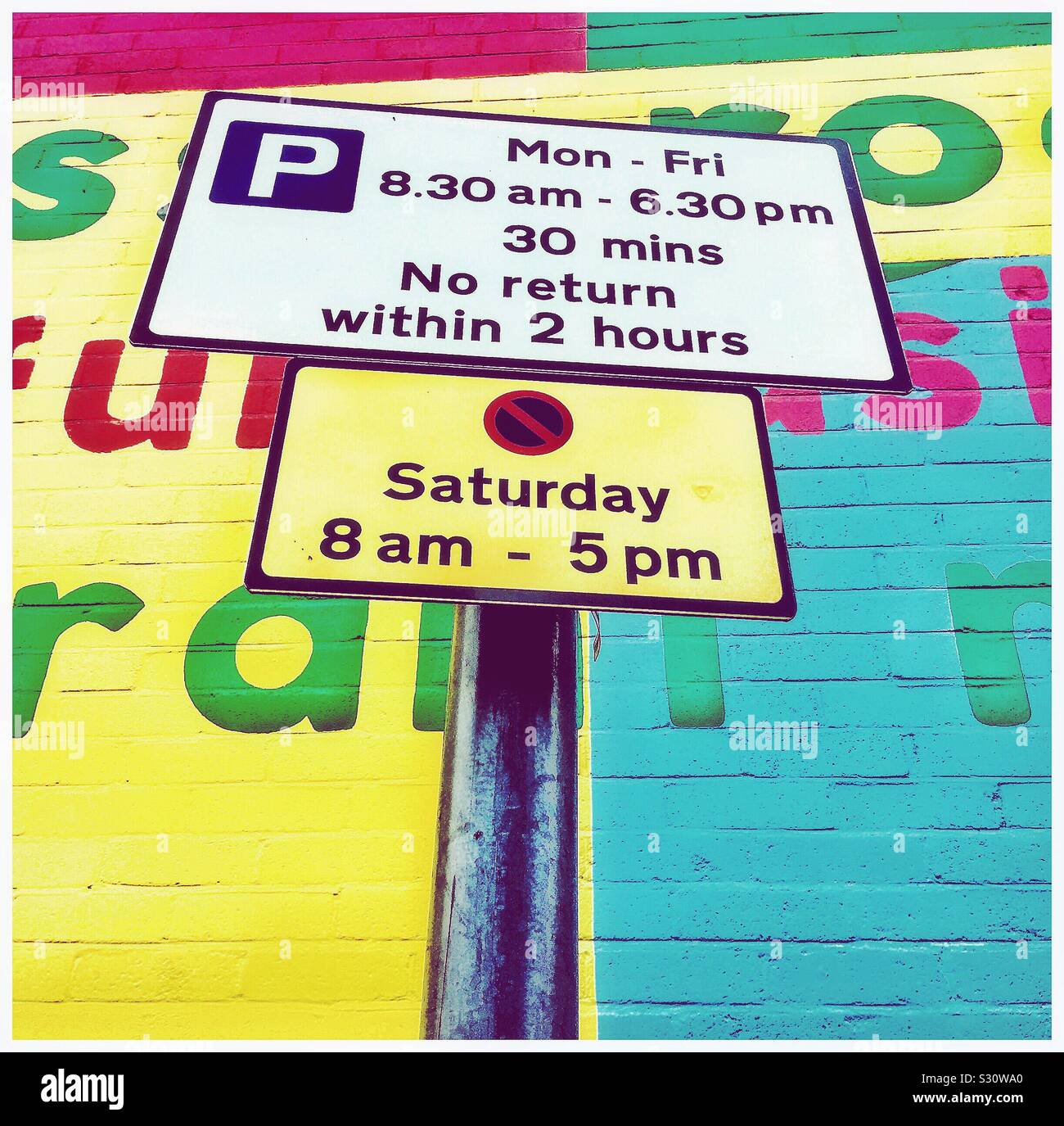 Colourful street signage Stock Photo - Alamy