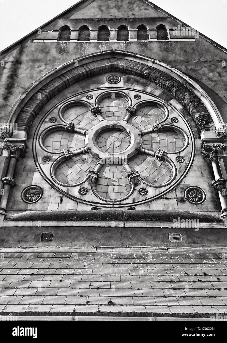 An ornate Victorian Gothic Revival Rose window on a building in London ...