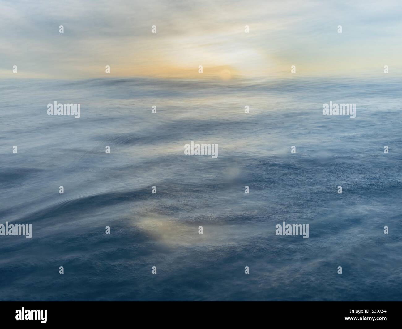 Ocean texture at sunset Stock Photo - Alamy
