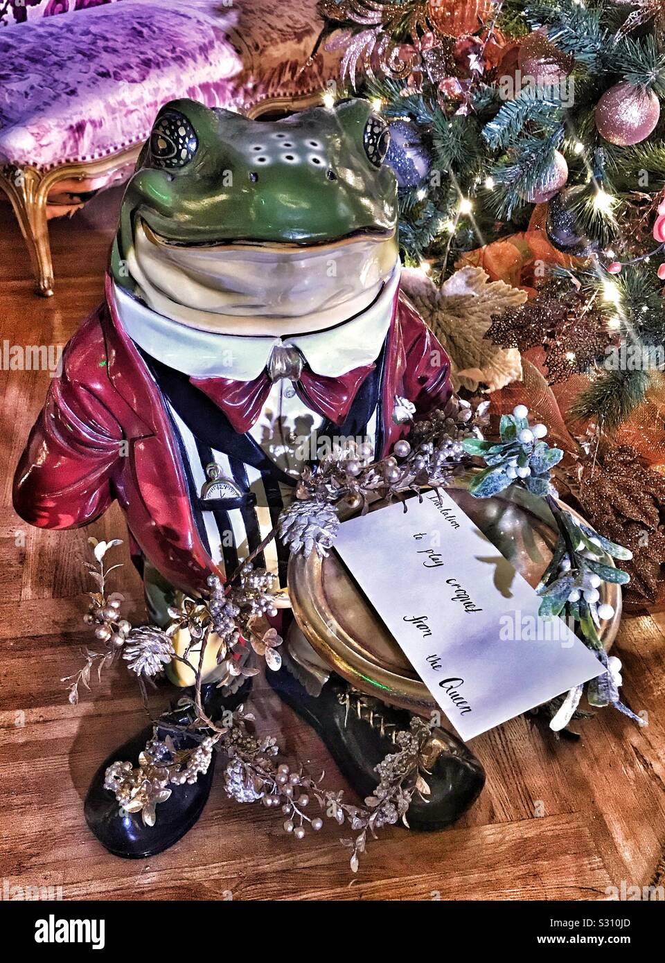 Toad holding a tray with an invite from the Queen to Croquet on the ...