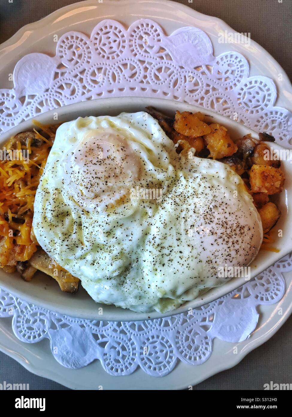 Over medium egg skillet with mushrooms, steak and cheese Stock Photo ...