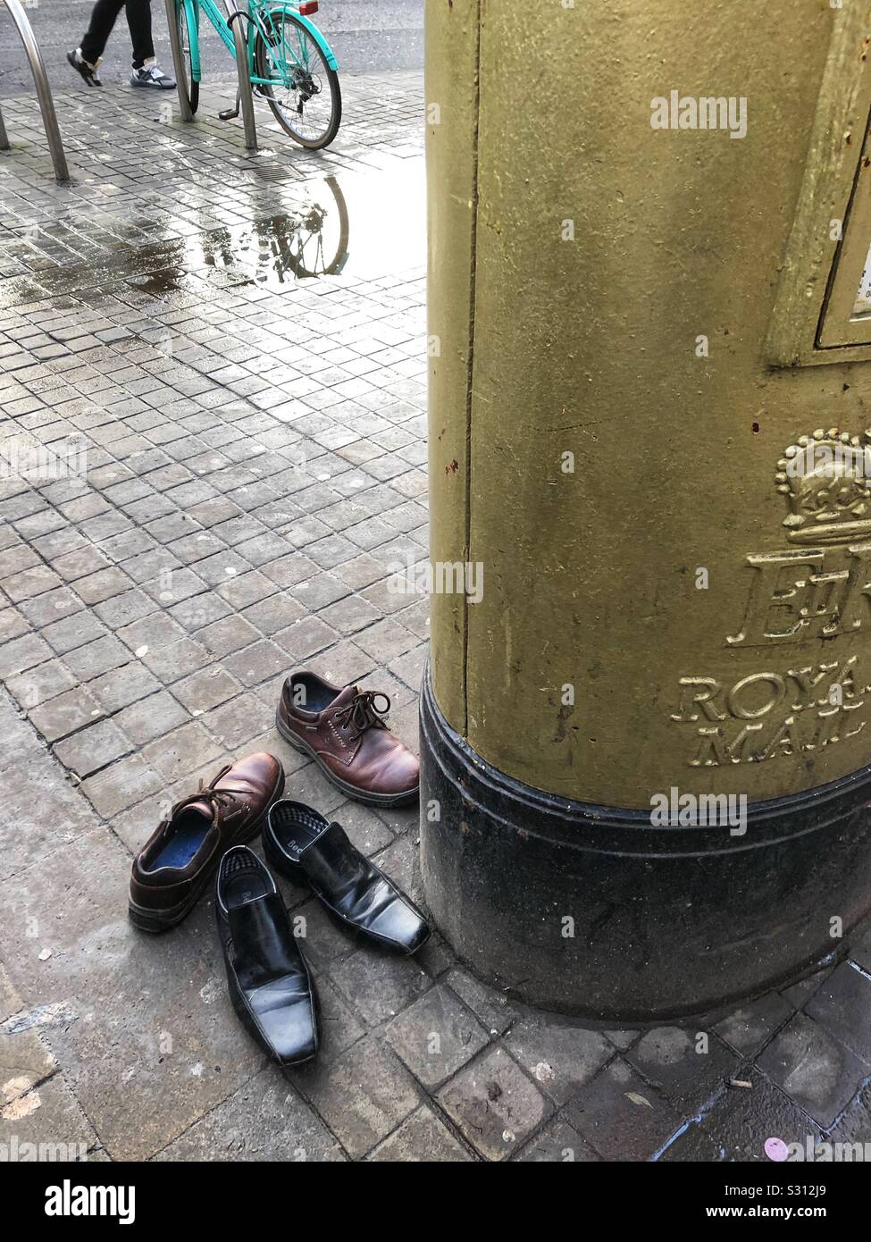 Gold post box and shoes Manchester Stock Photo - Alamy
