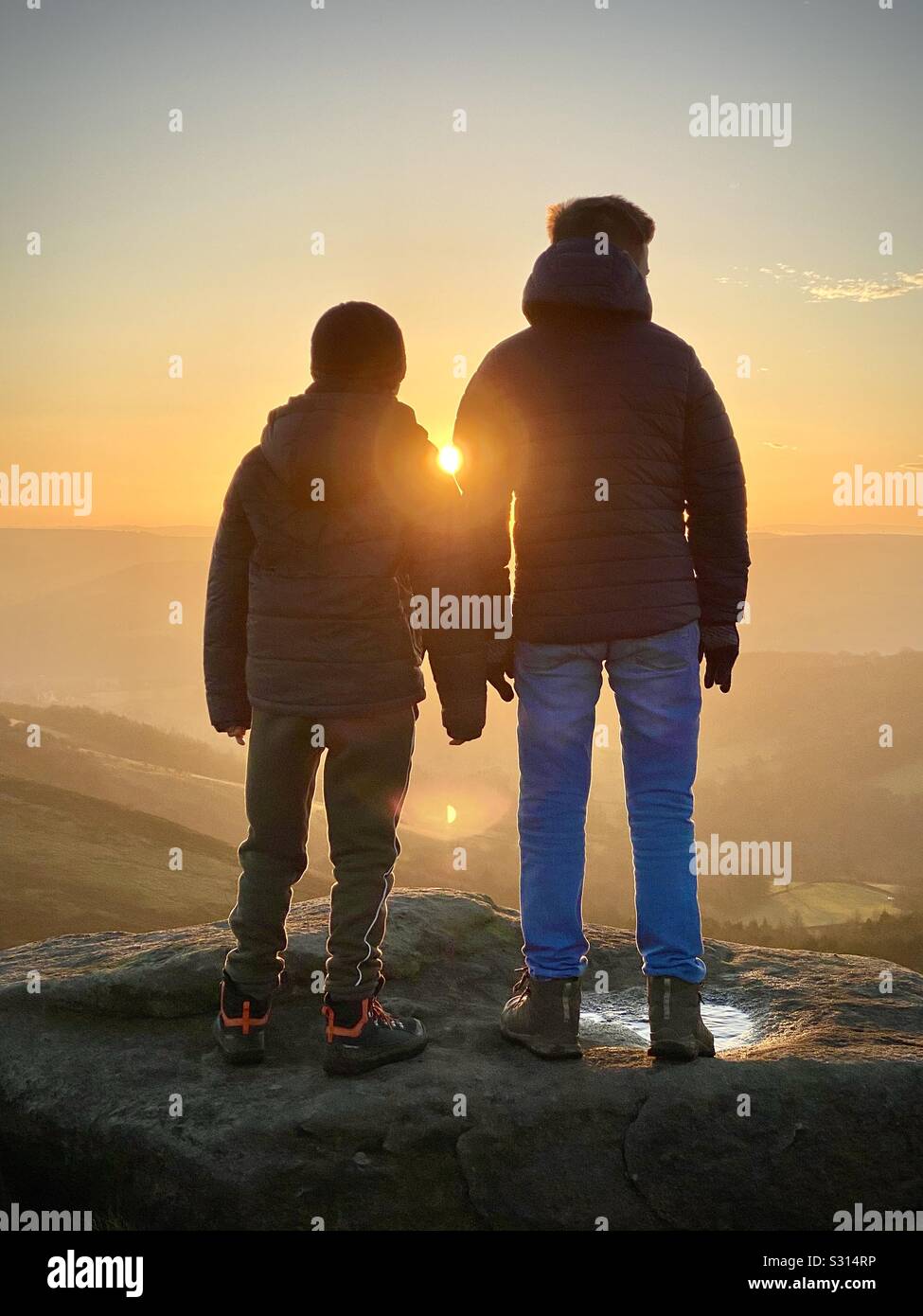 Two friends watching sunset hi-res stock photography and images - Alamy