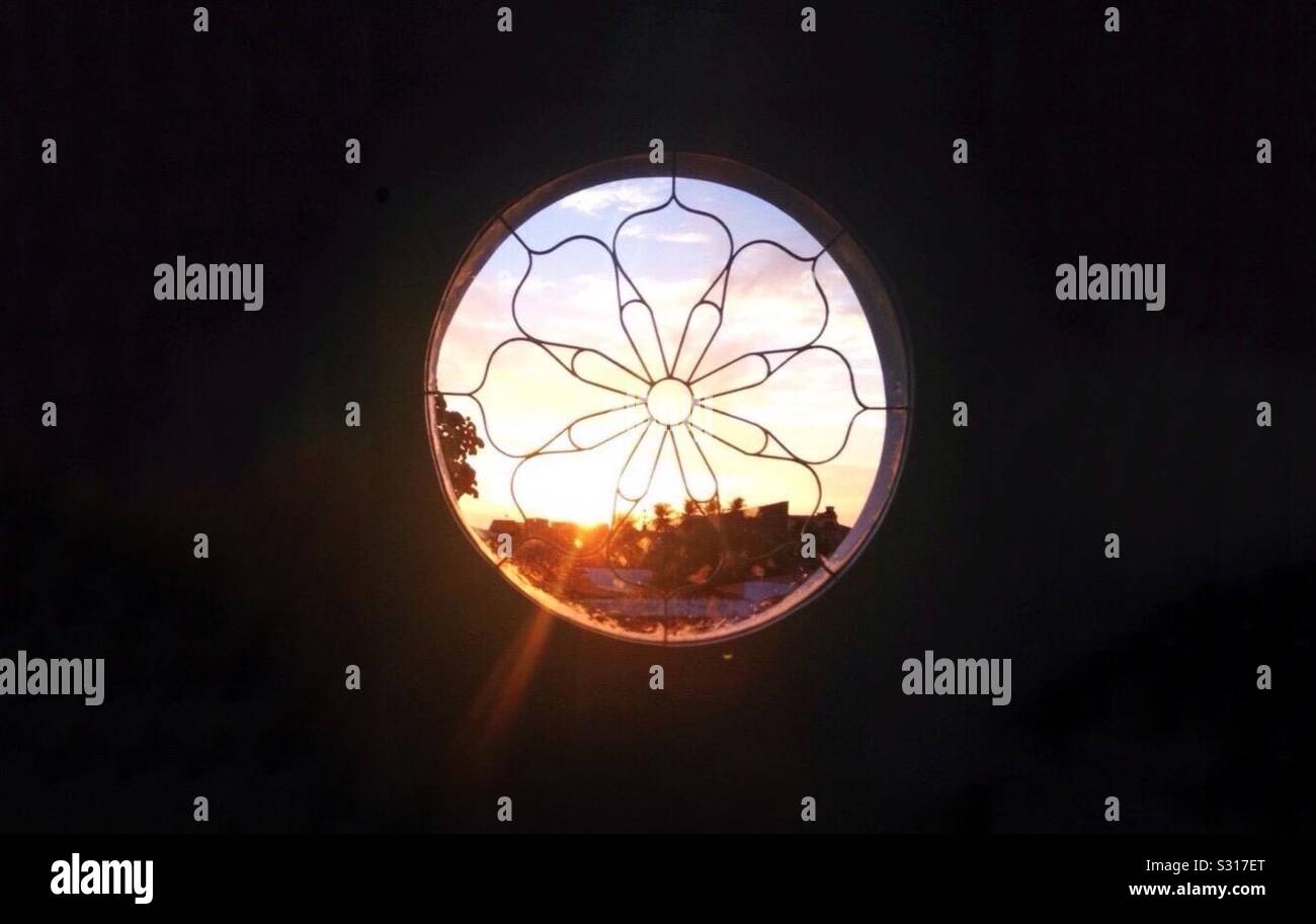 Sunset through glass window Stock Photo - Alamy