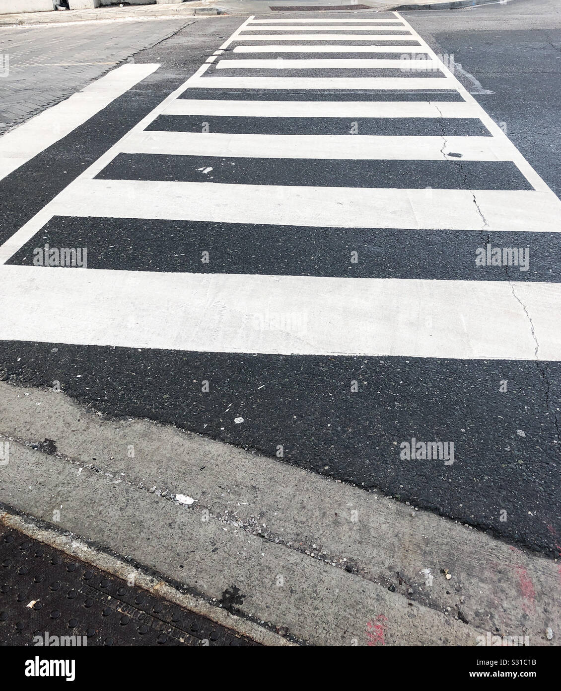 Crosswalk pattern on road Stock Photo - Alamy