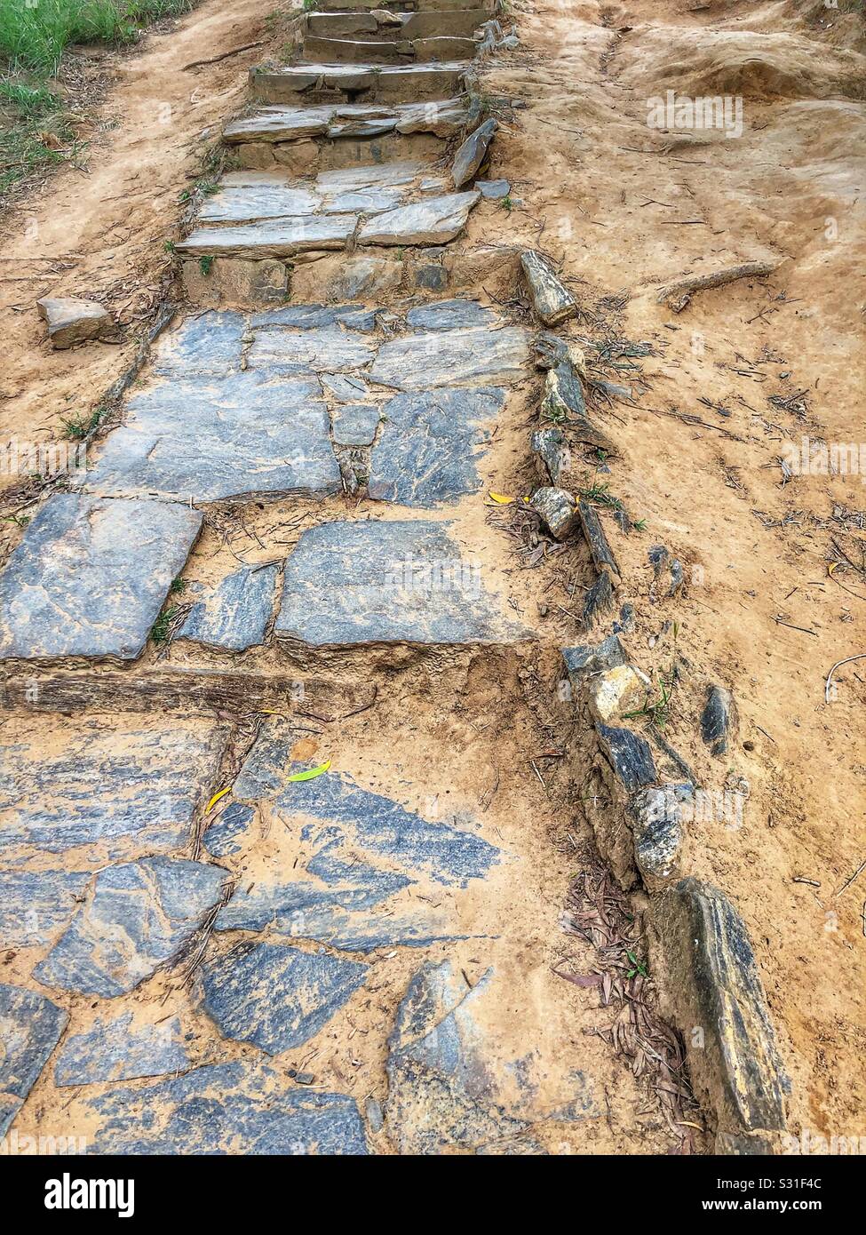 Broken up stone path Stock Photo - Alamy